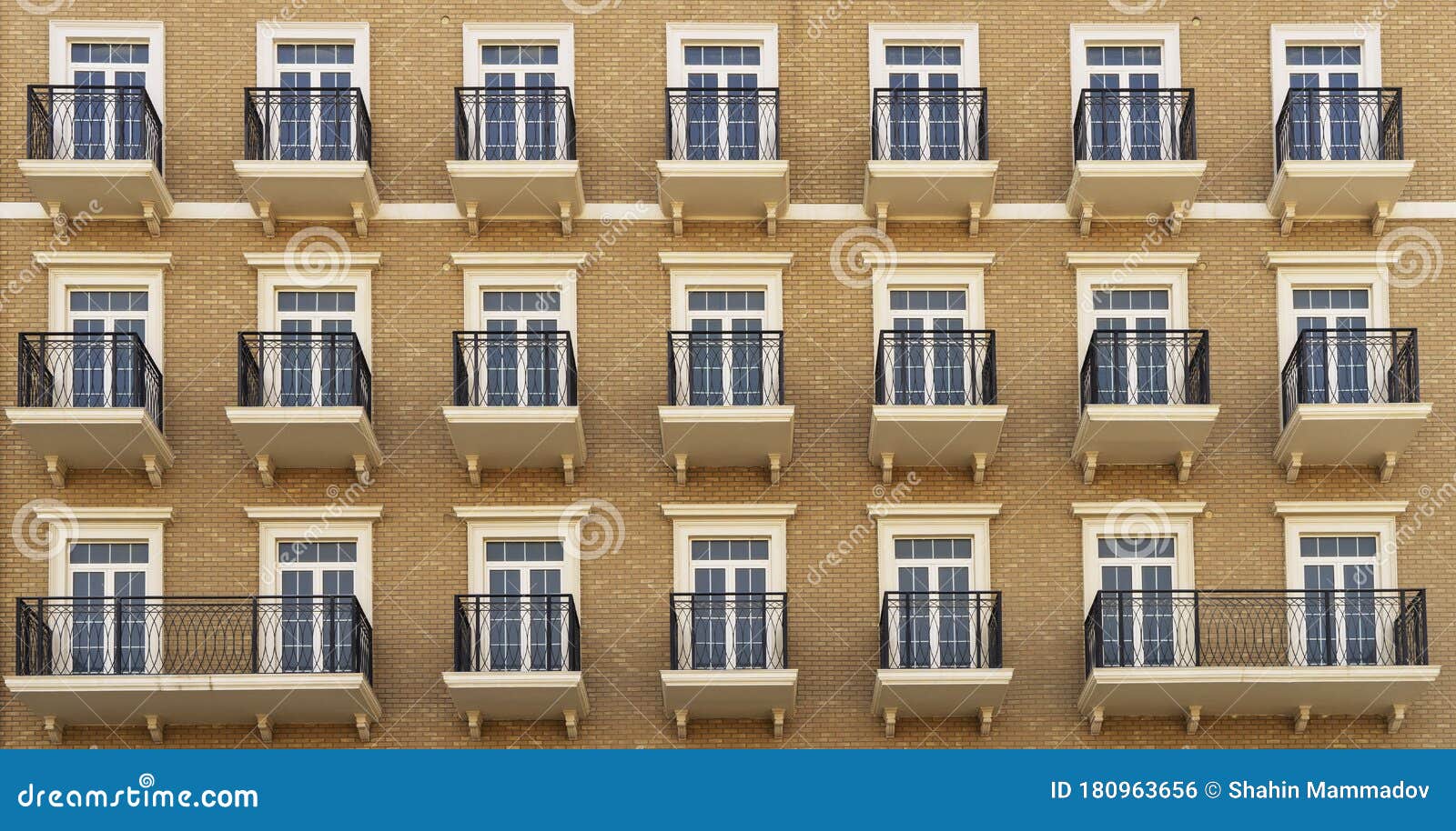 Front View of a Modern Residential Brown Brick Building with Balconies ...