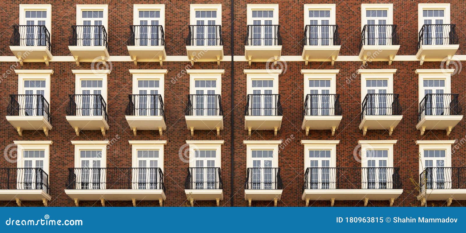 Front View of a Modern Residential Brown Brick Building with Balconies ...