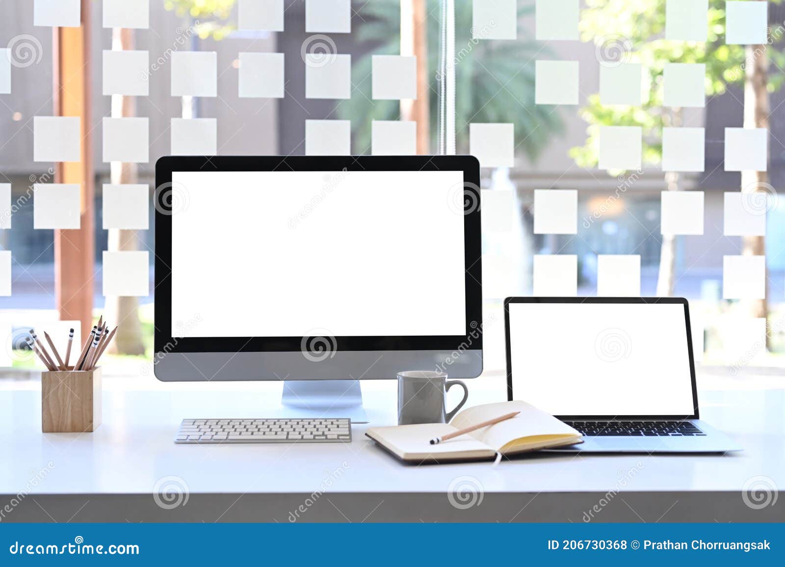 Front View of Modern Workstation with Blank Screen Computer and Laptop ...