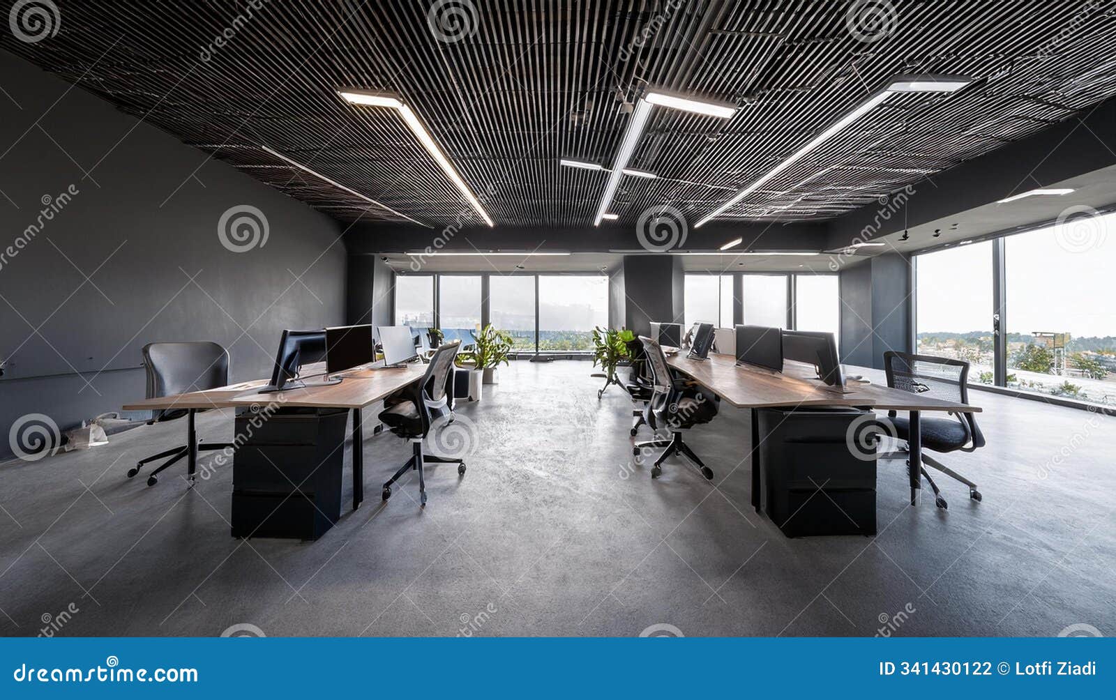 Front View of an Open Office Interior with Desks, Computers, a Concrete ...