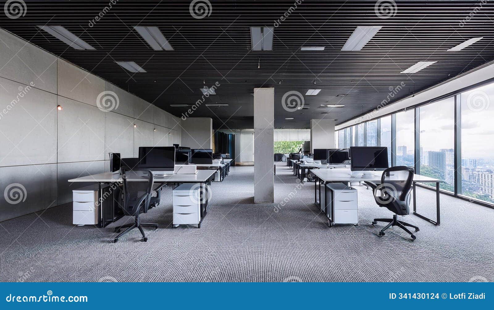 Front View of an Open Office Interior with Desks, Computers, a Concrete ...
