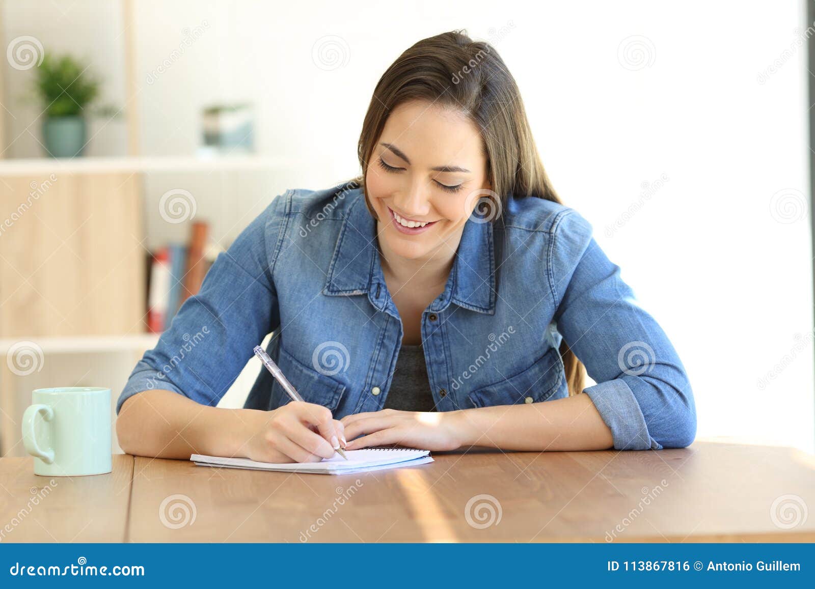 Woman Writing in a Notebook on a Table Stock Photo - Image of idea ...