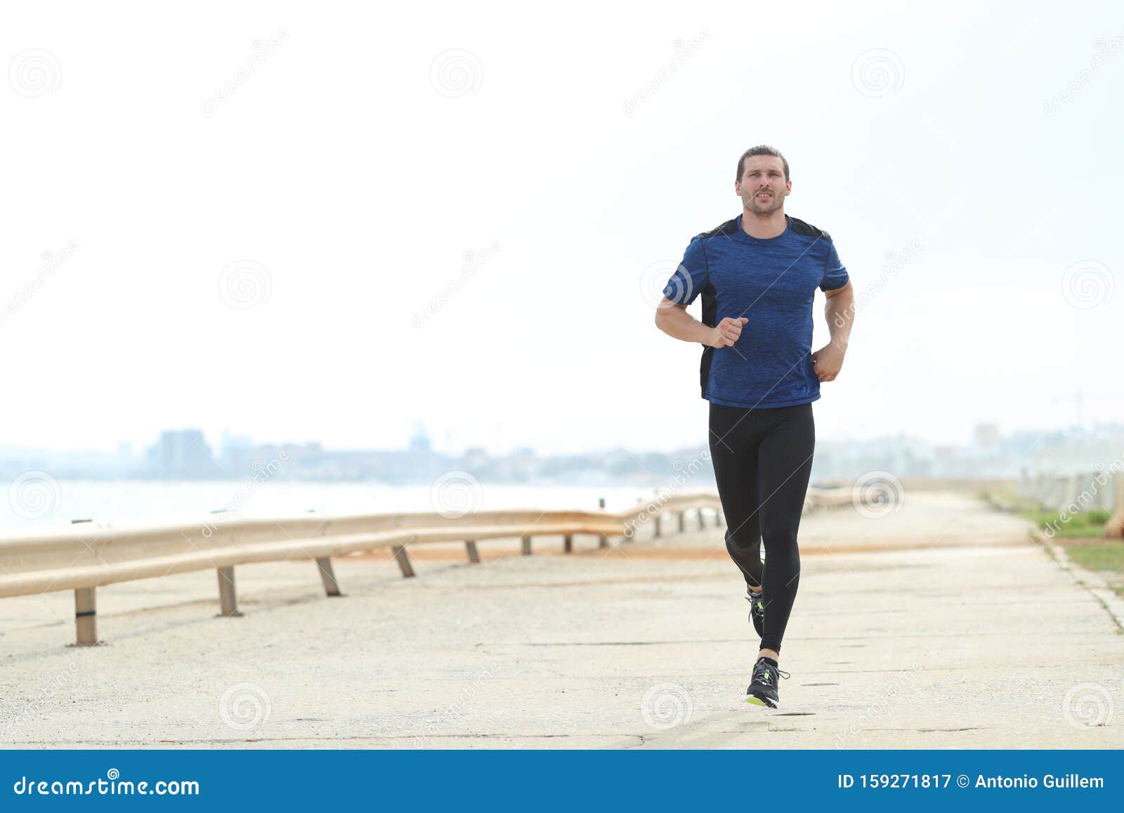 Front View of Runner Running on the Beach Stock Image - Image of ...