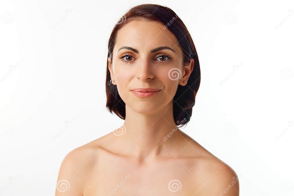 Front View Portrait Of Young Smiling Woman With Bare Shoulders And