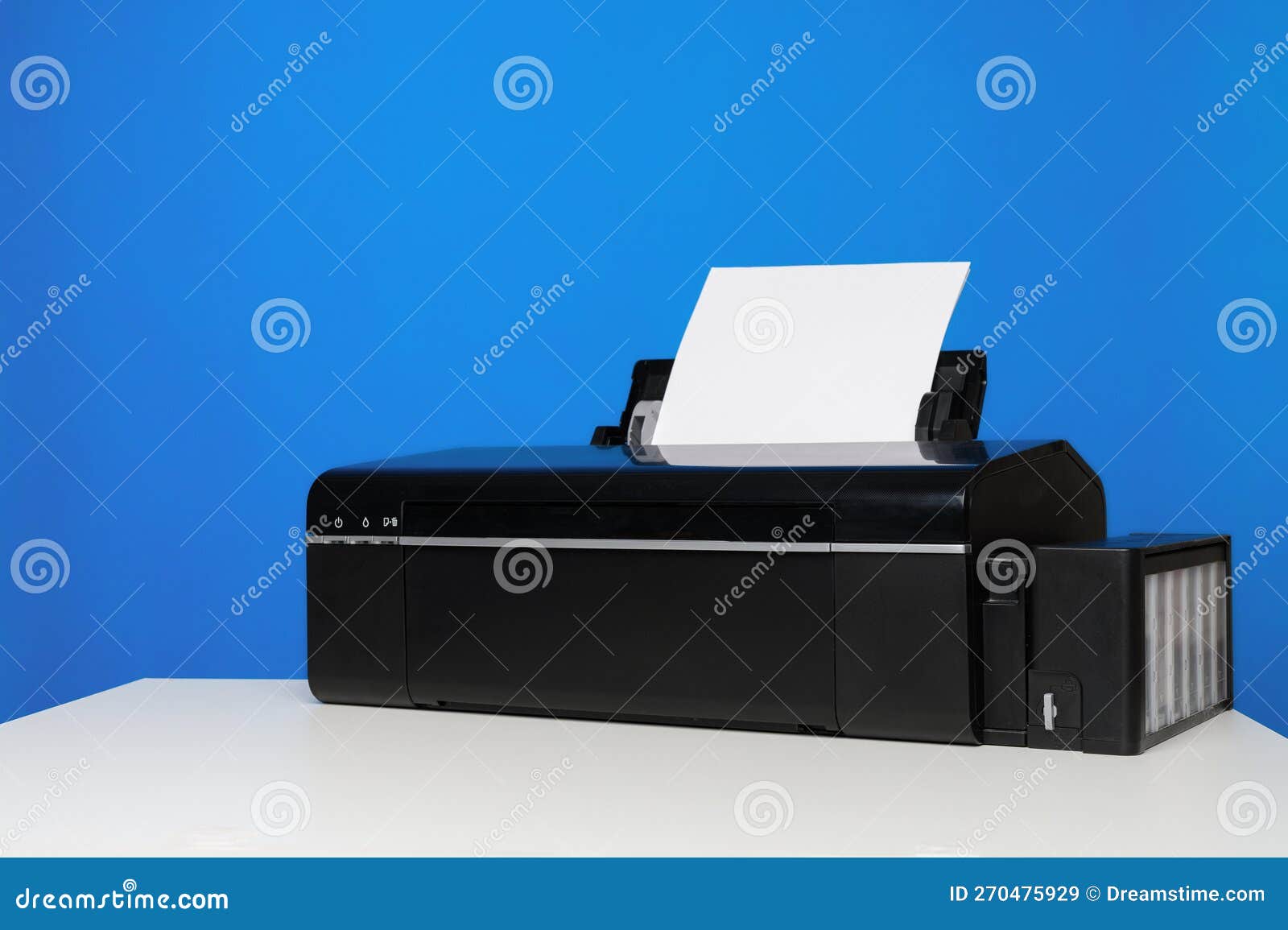 Front View of a Printer and a Blank Sheet of A4 Paper on a Blue ...