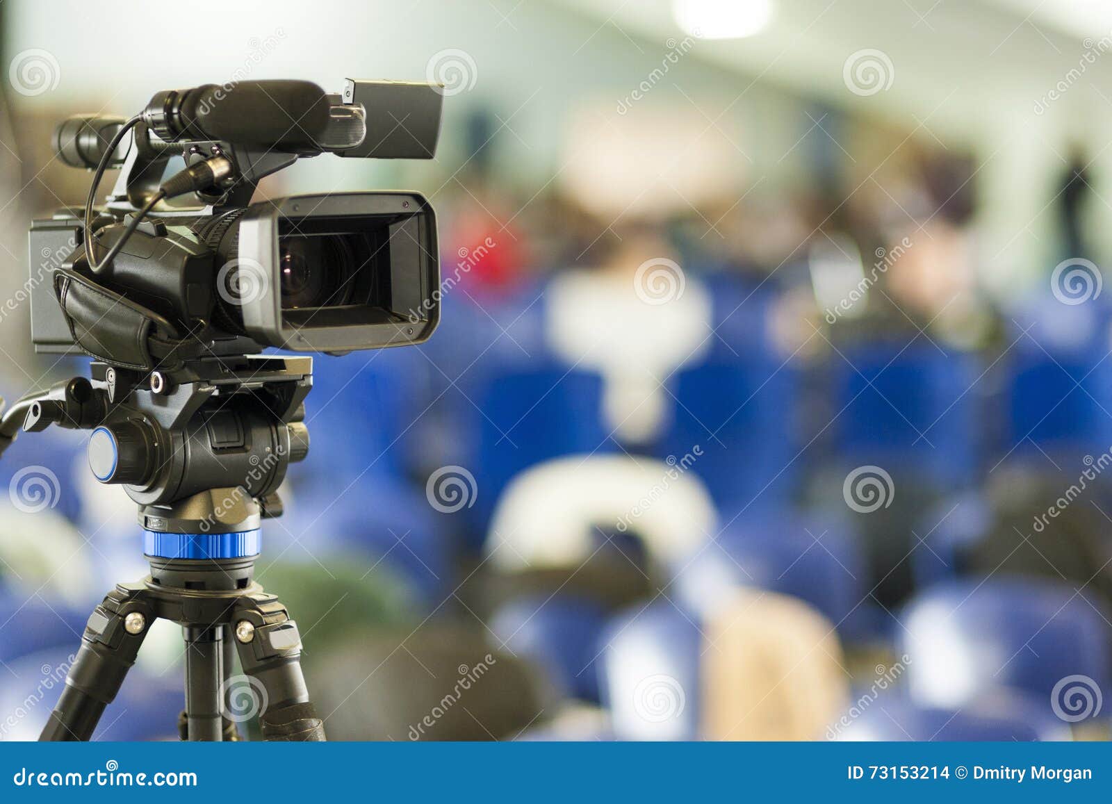 Front View of Professional Videocamera. Positioned Against Blurred ...