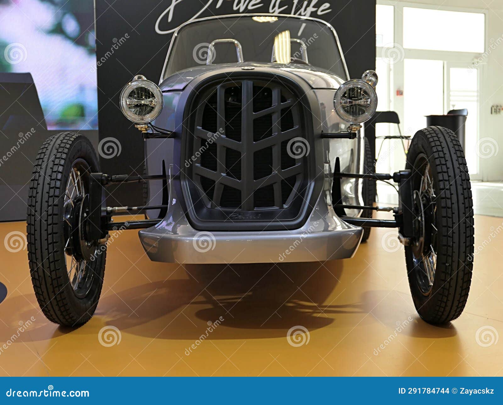 Front View of Silver Electric Version of Stylish Microcar Roadster ...