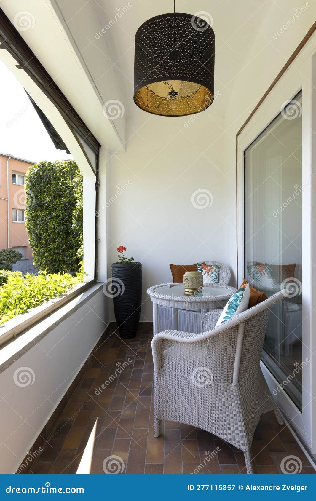Front View of a Small Terrace Overlooking Nature. There are Two Chairs ...