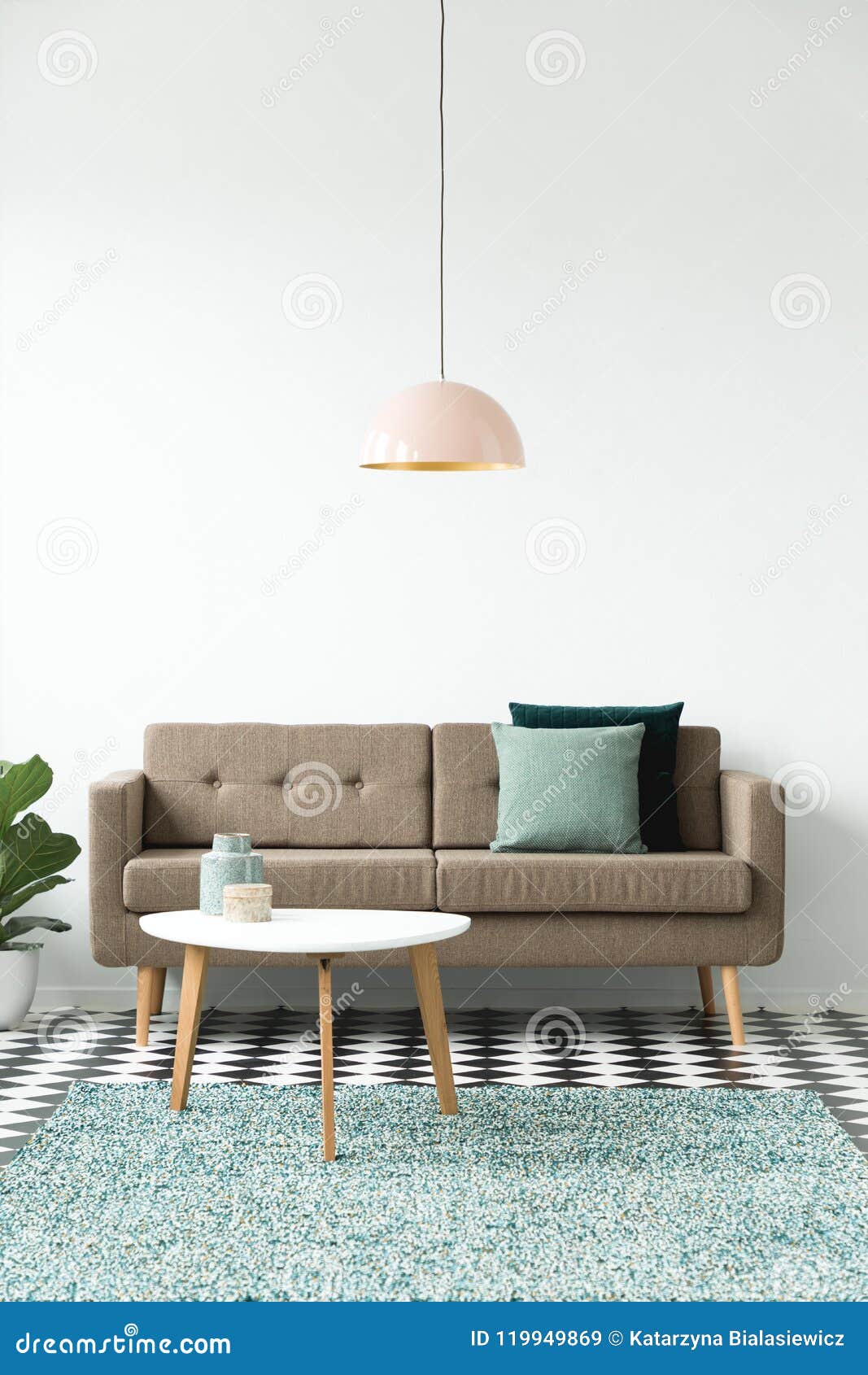Front View of a Sofa with Pillows, Coffee Table, Chandelier and Stock ...