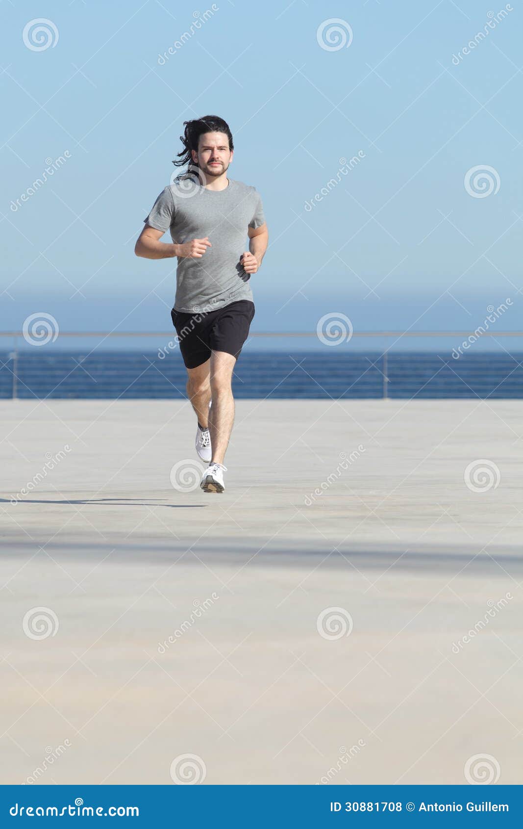 Front View of a Sportsman Running on the Concrete of the Seafront Stock ...