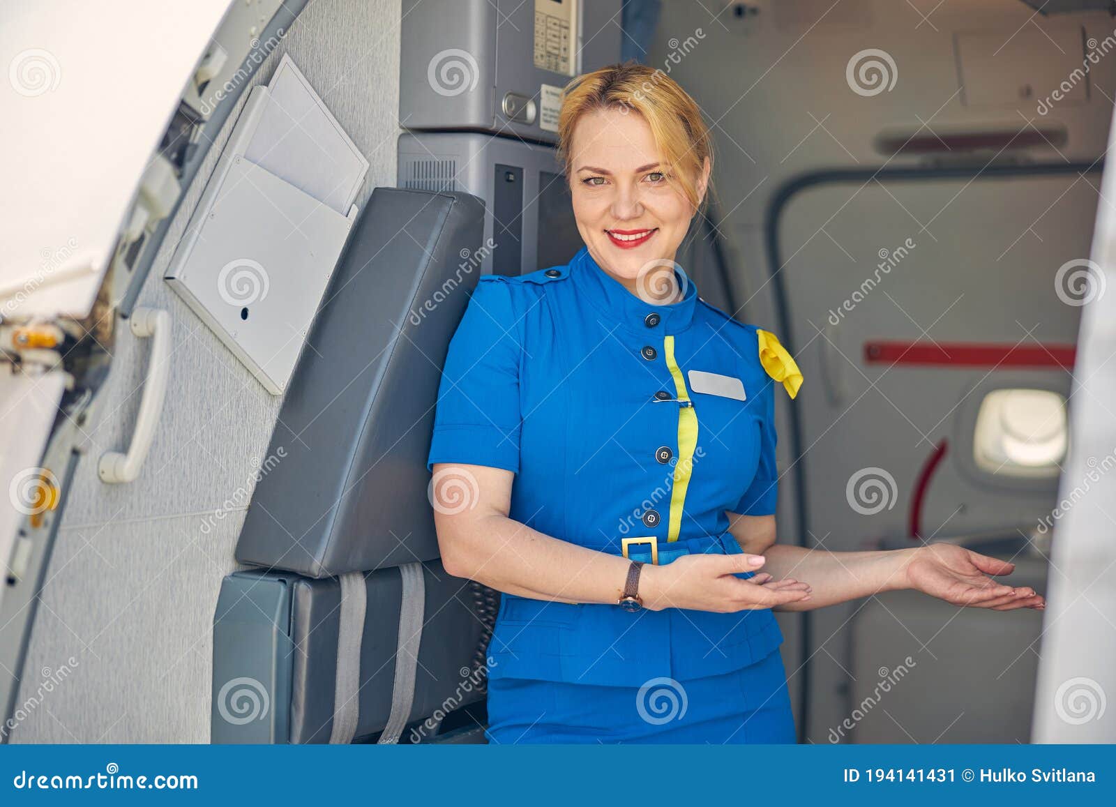 Smiling Flight Attendant Looking at the Camera Stock Image - Image of ...
