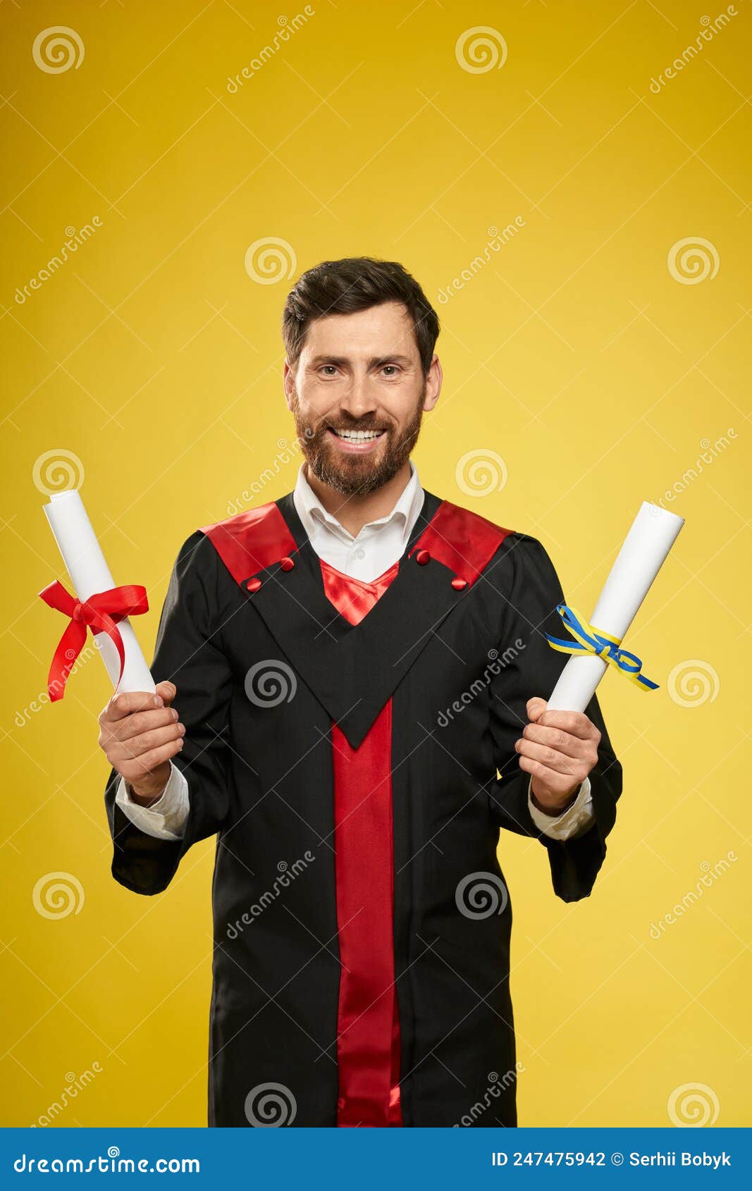 Student with Beard Standing, Holding Two Diplomas. Stock Photo - Image ...
