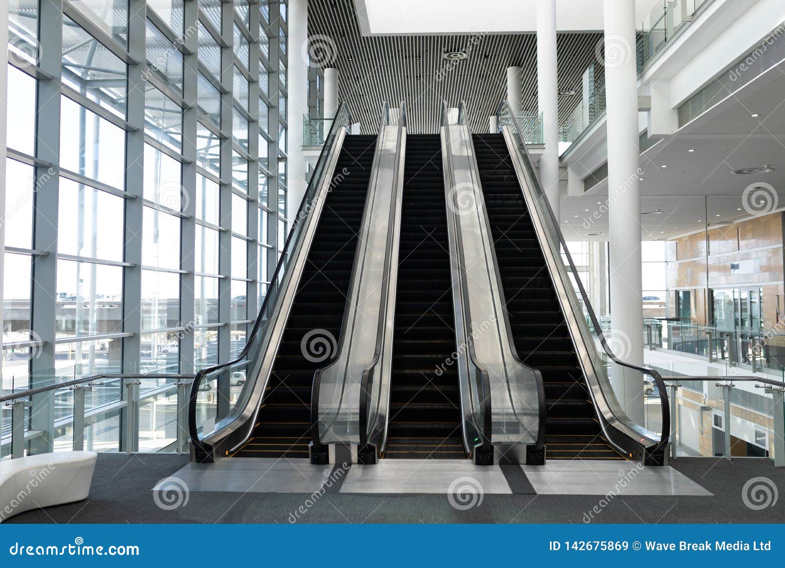 Front View of Three Modern Escalators in a Office Lobby Stock Image ...