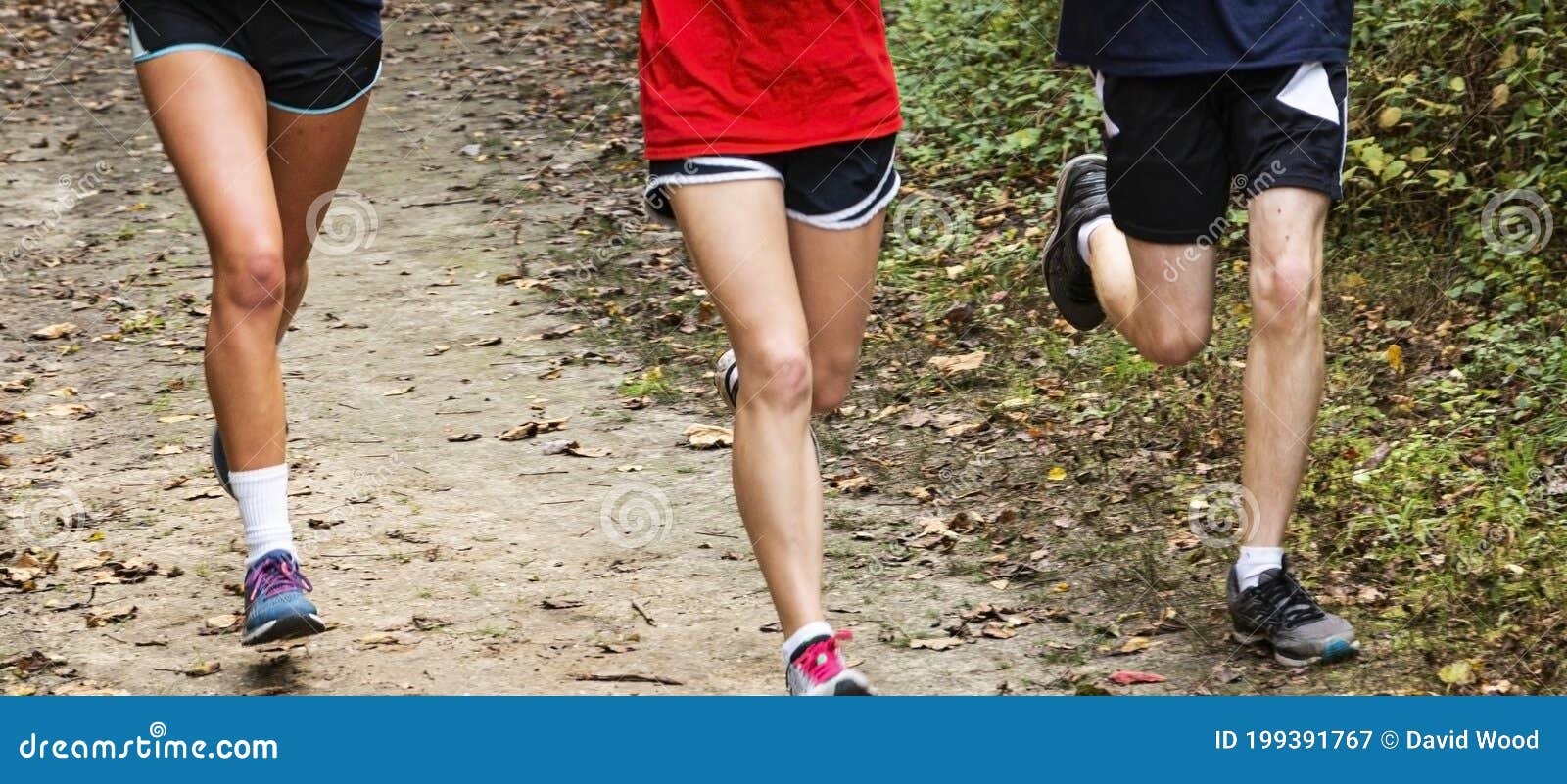 Legs of Three Runners on a Dirt Path Running Toward Camera Stock Image ...