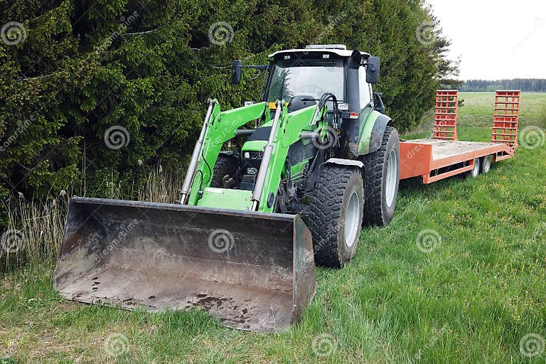 Front View of Tractor with Front End Loader and Trailer Editorial Image ...