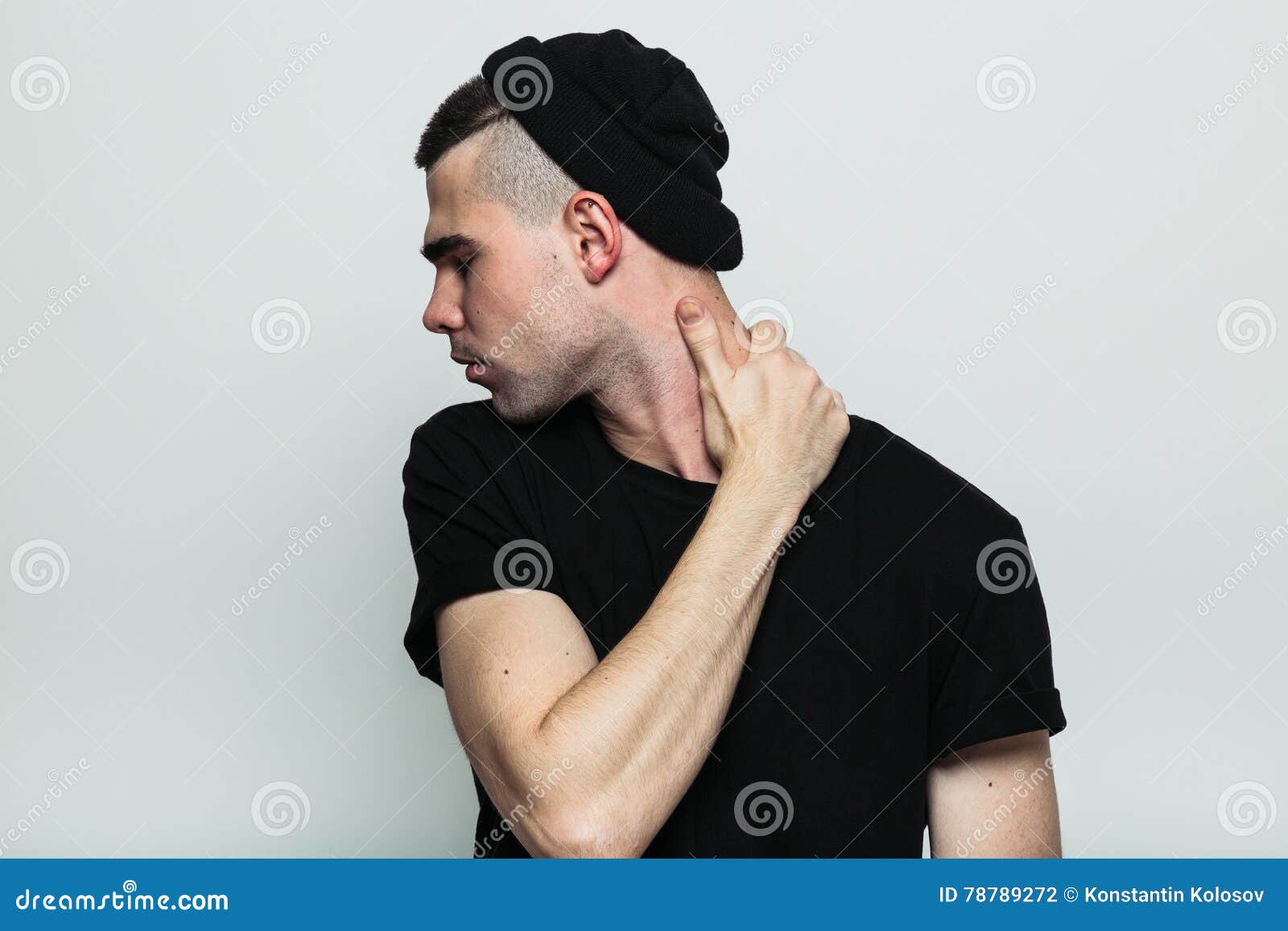 Front View of Turned Man Touching His Neck Stock Photo - Image of ...