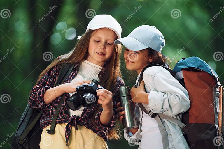 Front View Of Two Girls That Is In The Forest Having A Leisure Activity Stock Image Image Of