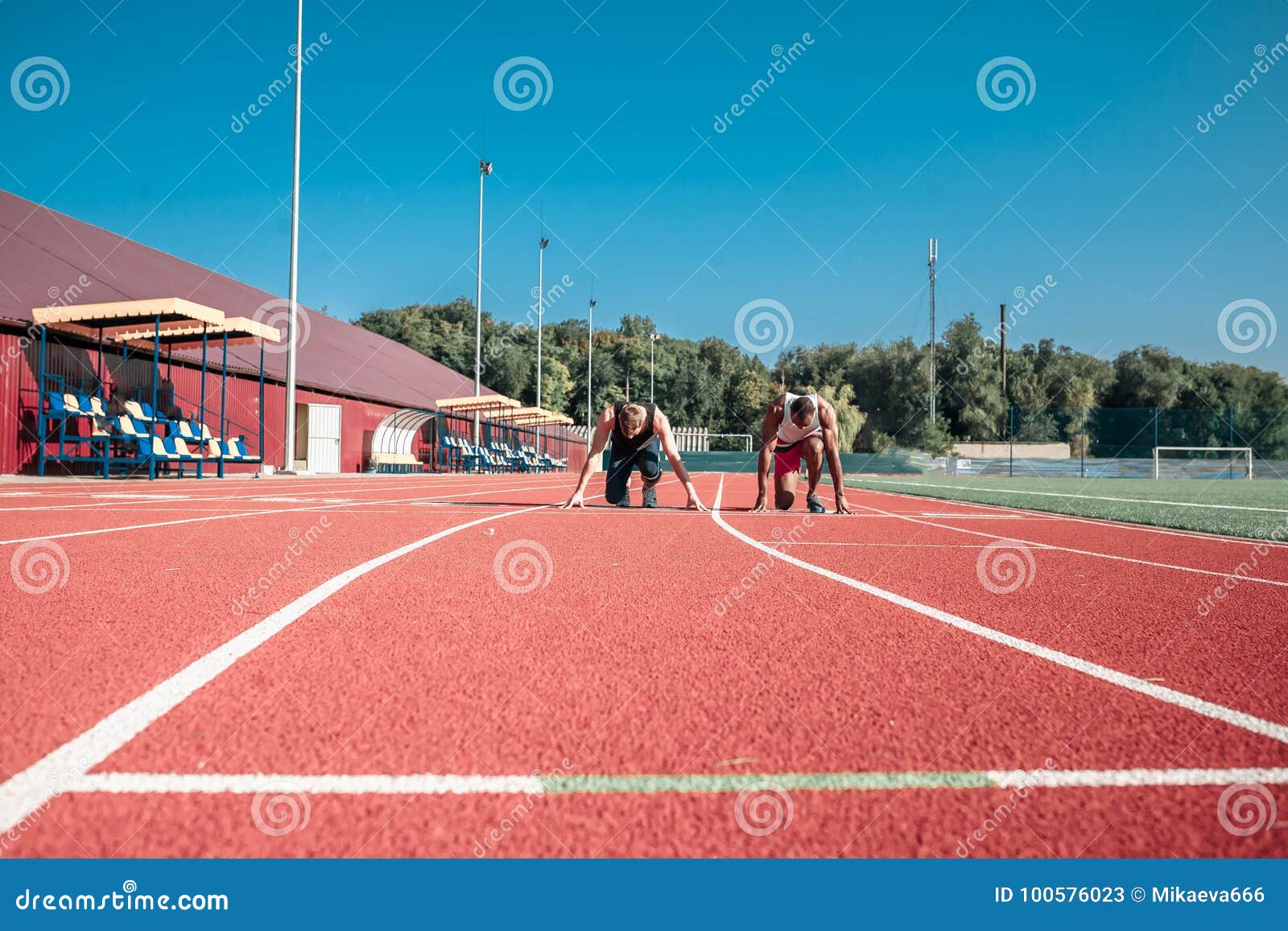 Front View of Two Runners at the Start of the Sky Background Stock ...