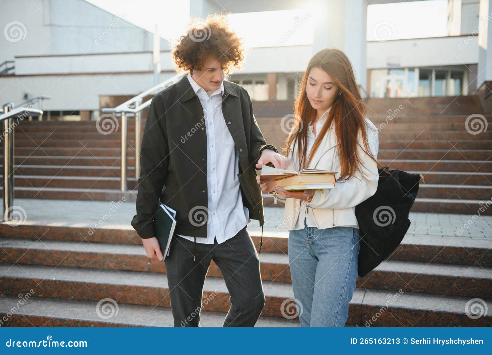 Front View of Two Students Walking and Talking in an University Campus ...
