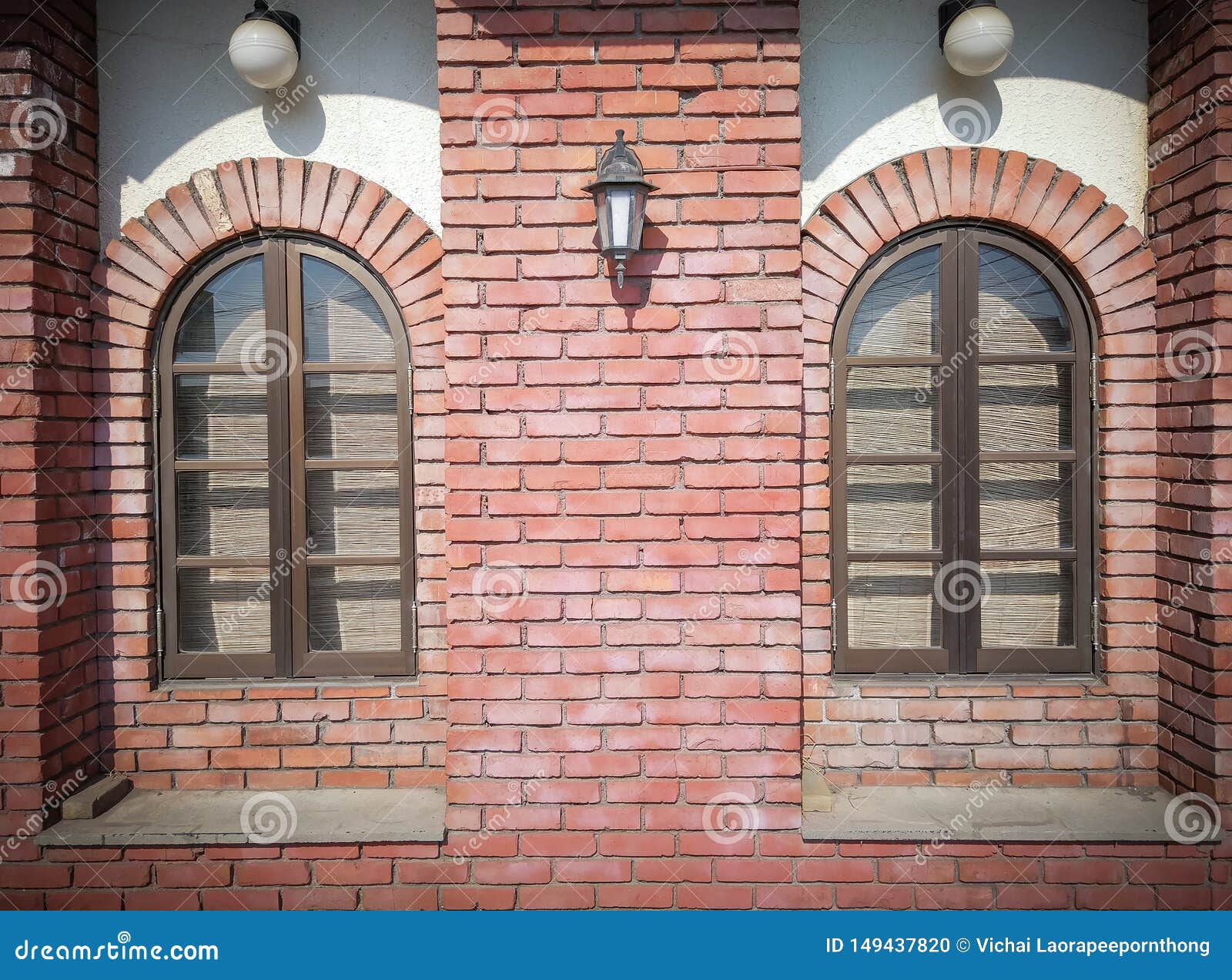 Front View of Two Vintage Rounded Window on Weathered Red Brick Blocks ...