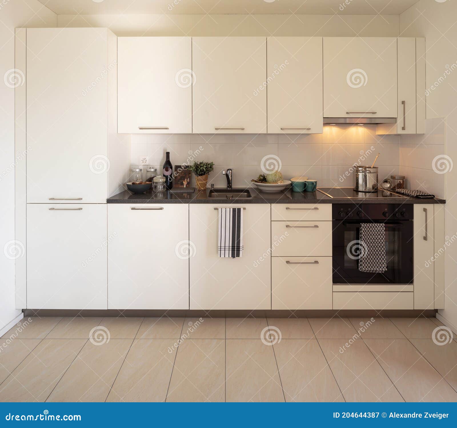 Front View of White Modern Kitchen with Lights on Stock Image - Image ...