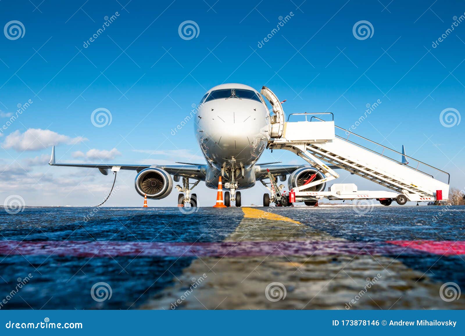 Front View of White Passenger Airplane with a Boarding Steps at the ...
