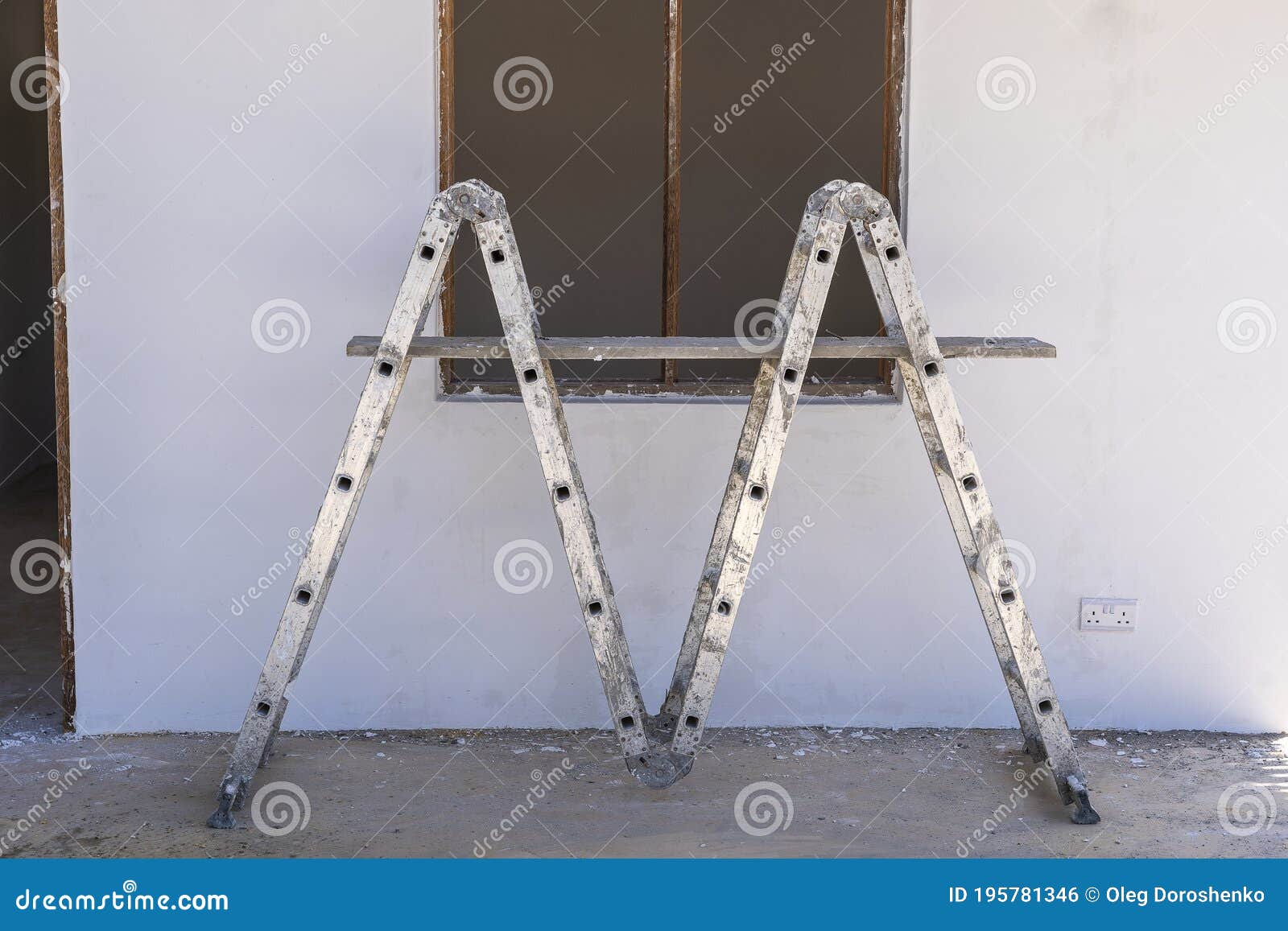 Front View of Window Frame, Ladder and White Concrete Wall in ...