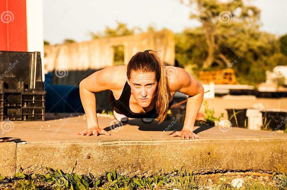 Front View of Woman Doing Pushups Outside Stock Image - Image of ...