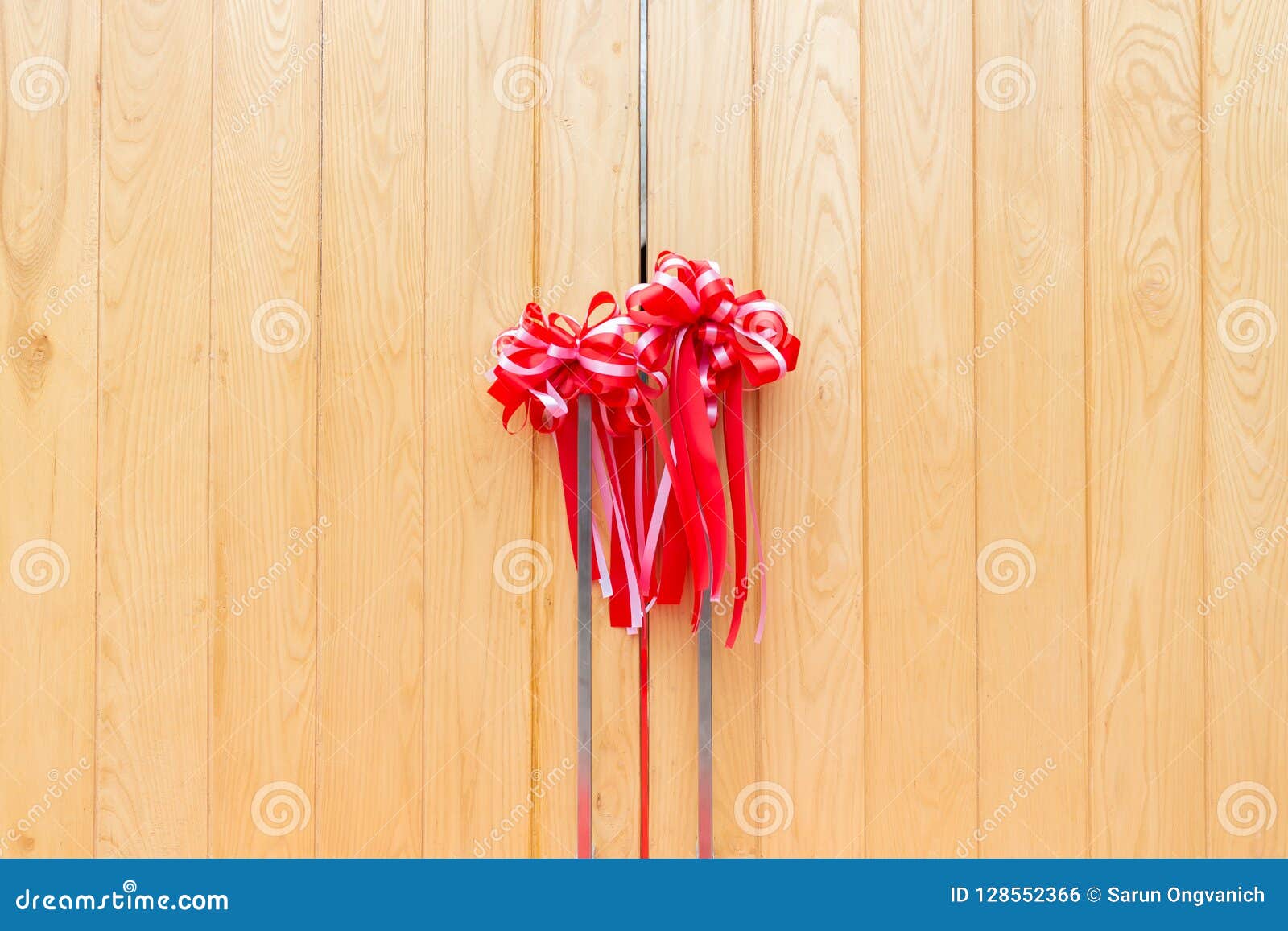 Fornt View of Wooden Gate with Red Ribbon Satin Bows. Stock Photo ...
