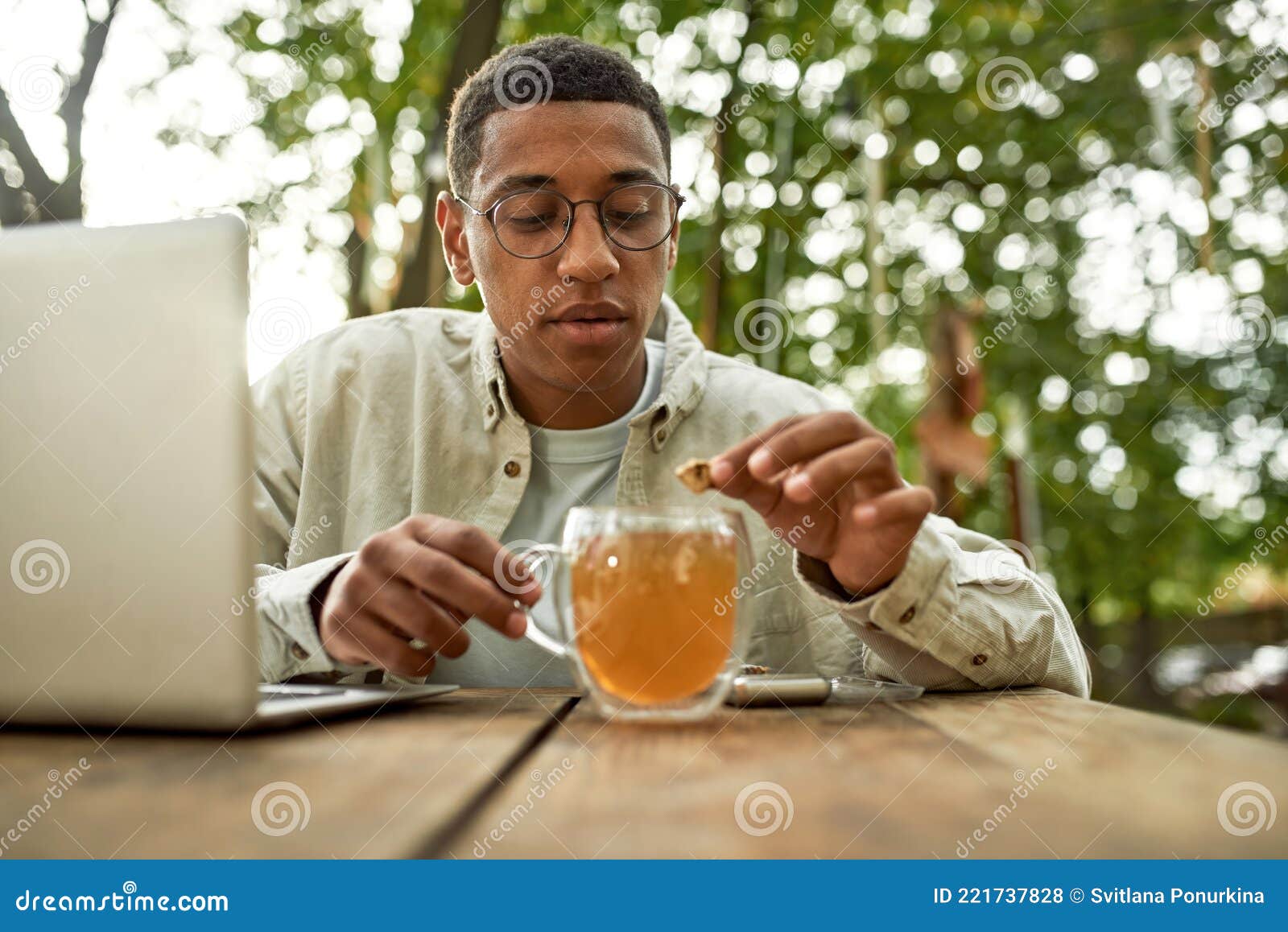 Front View of a Young Black Man Making Himself a Cup of Tea Stock Photo ...