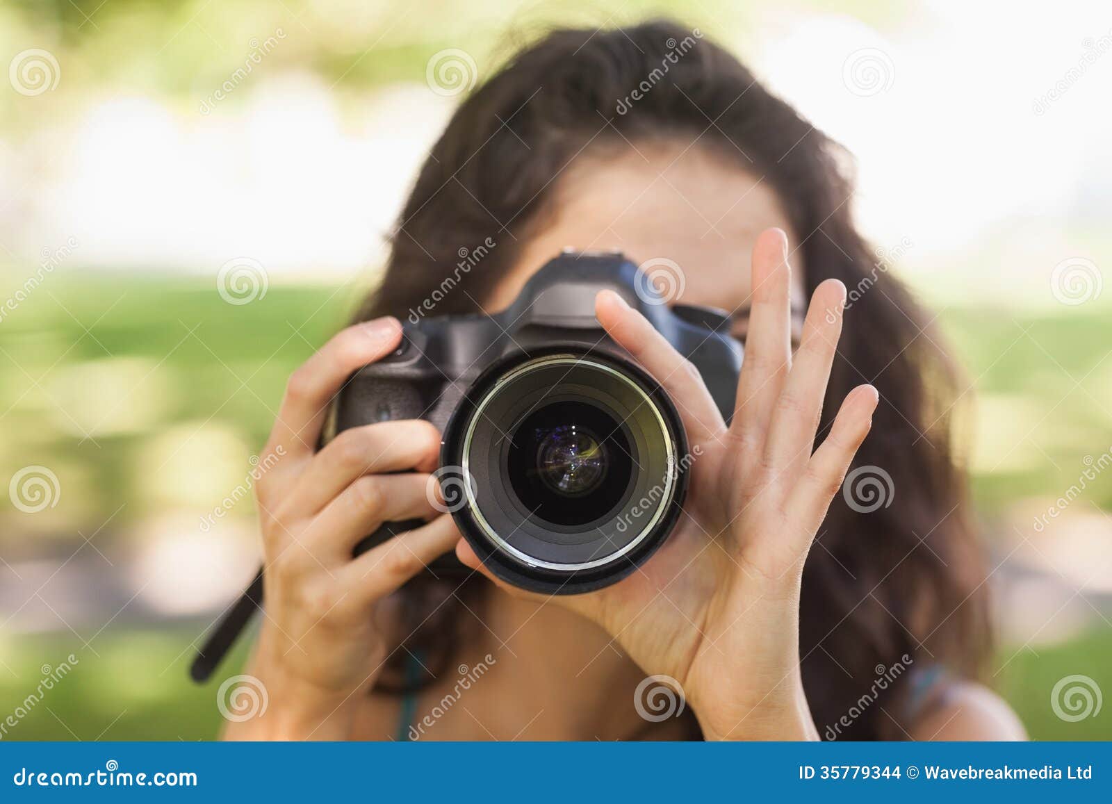 Front View of Young Brunette Woman Taking a Picture Stock Photo - Image ...
