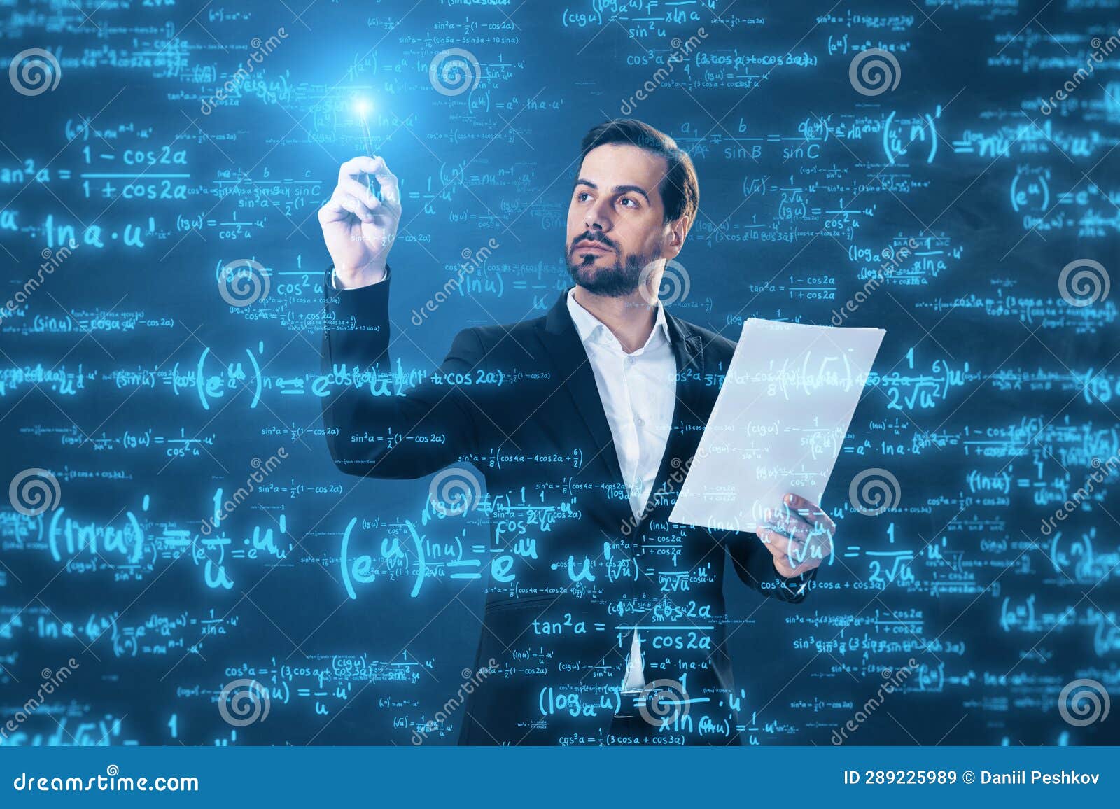 Front View of Young European Businessman with Document in Hand Using ...