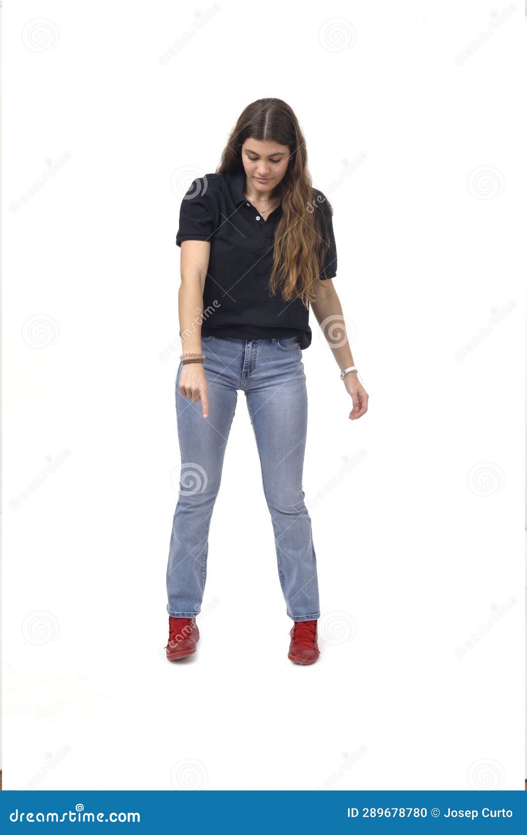 View of a Young Girl Pointing Down on White Background Stock Photo ...