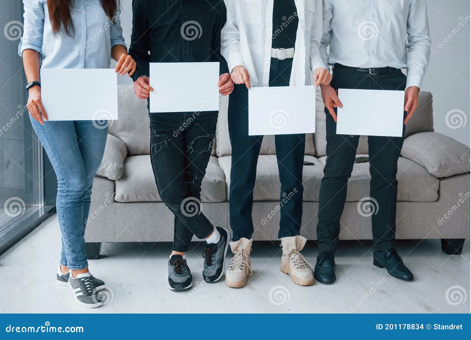 Front View of Young Group of Friends that Holding Empty Papers in Hands ...