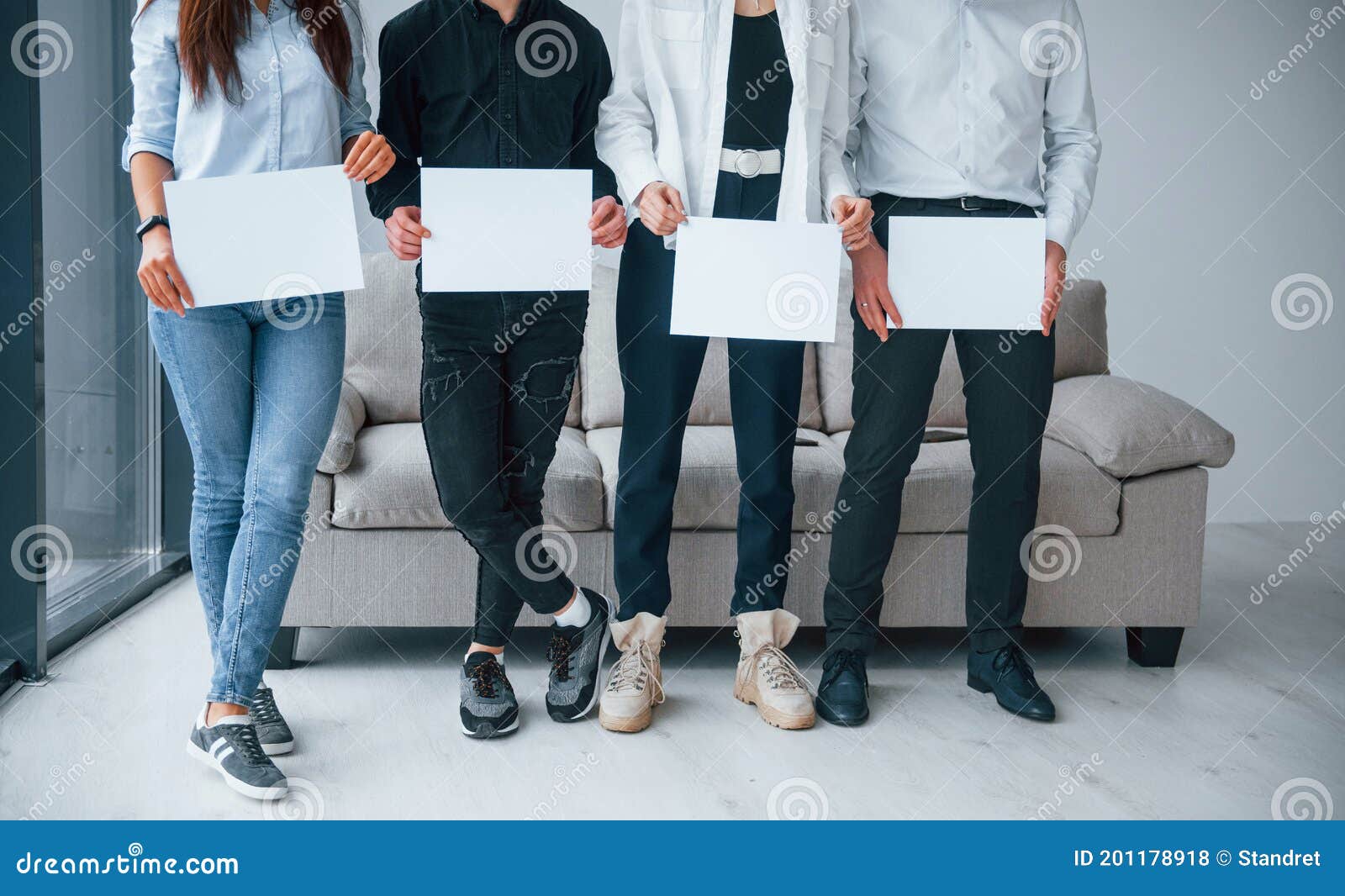 Front View of Young Group of Friends that Holding Empty Papers in Hands ...