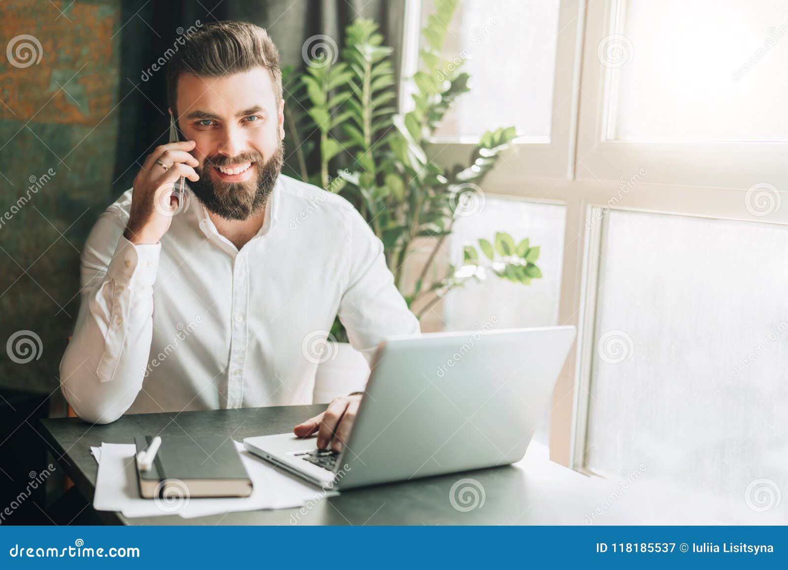 Front View. Young Smiling Bearded Businessman is Sitting in Office at ...