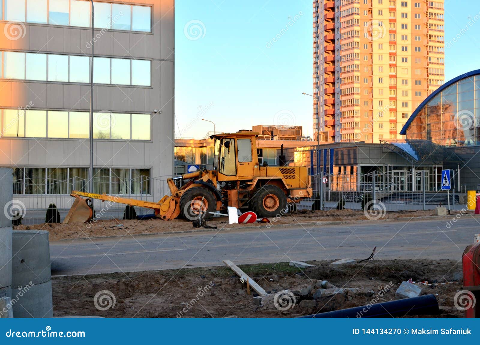 Front Wheel Loader Working on the Working Platform on the Street during ...