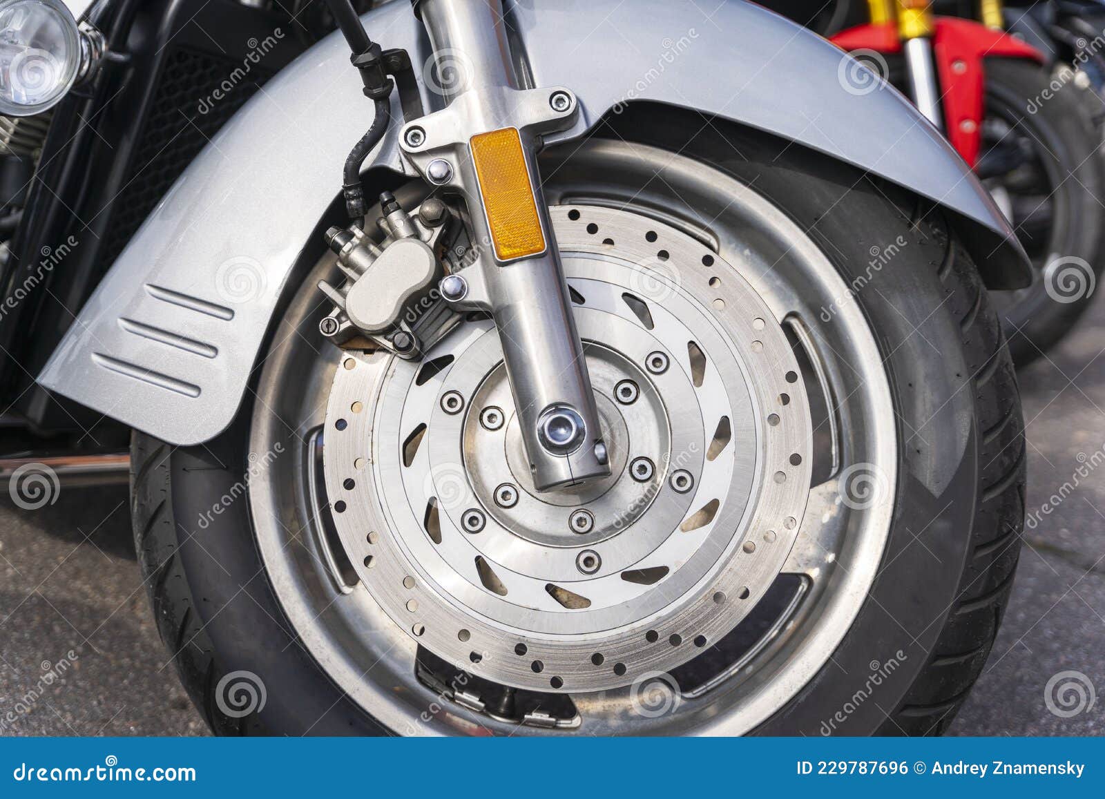 The Front Wheel of a Motorcycle, a Side View of the Front Wing of a ...