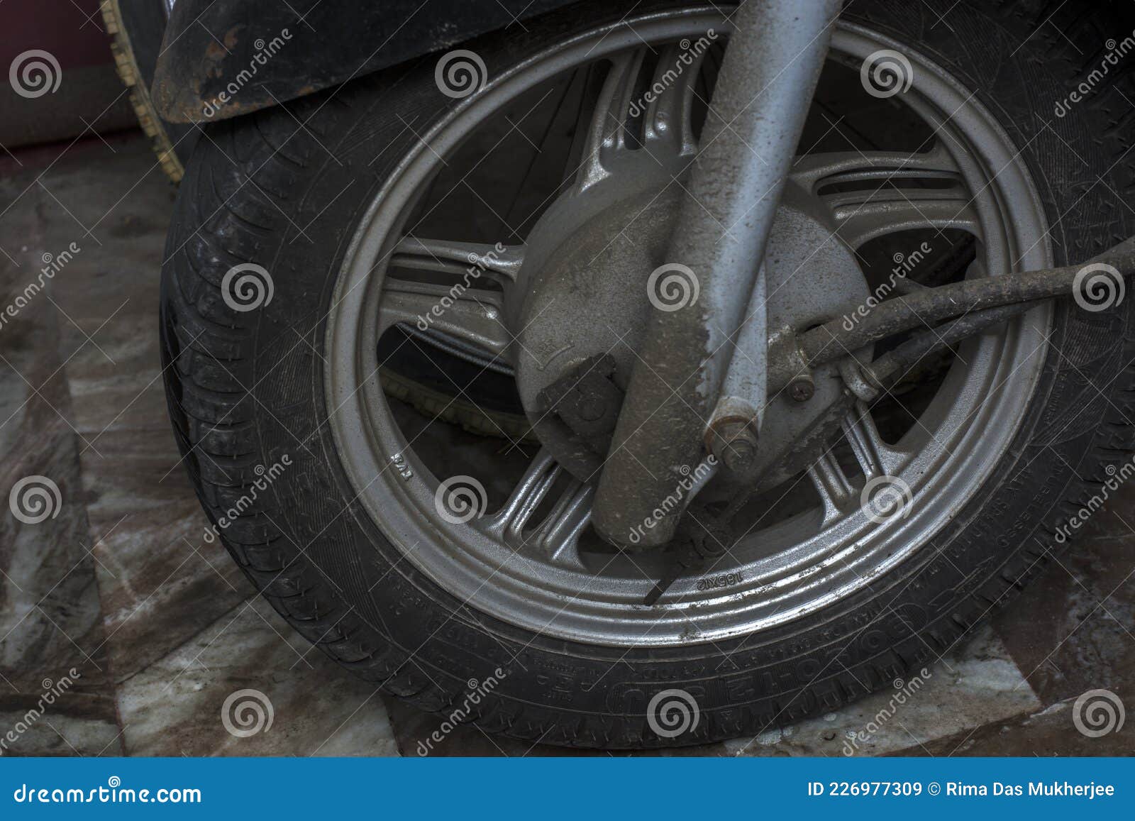 Front Wheel of a Scooter with Lots of Dust and Mud Stock Image - Image ...