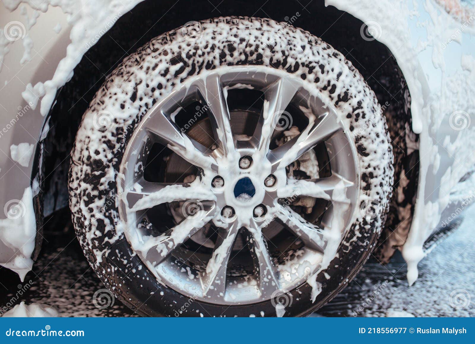 Front wheel in soapy foam stock image. Image of foam - 218556977