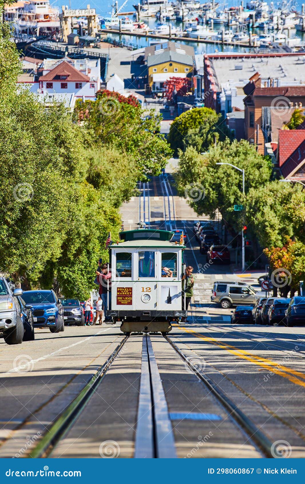 Front of White Trolley 12 Going Uphill on Sunny Day with Pier at End of ...