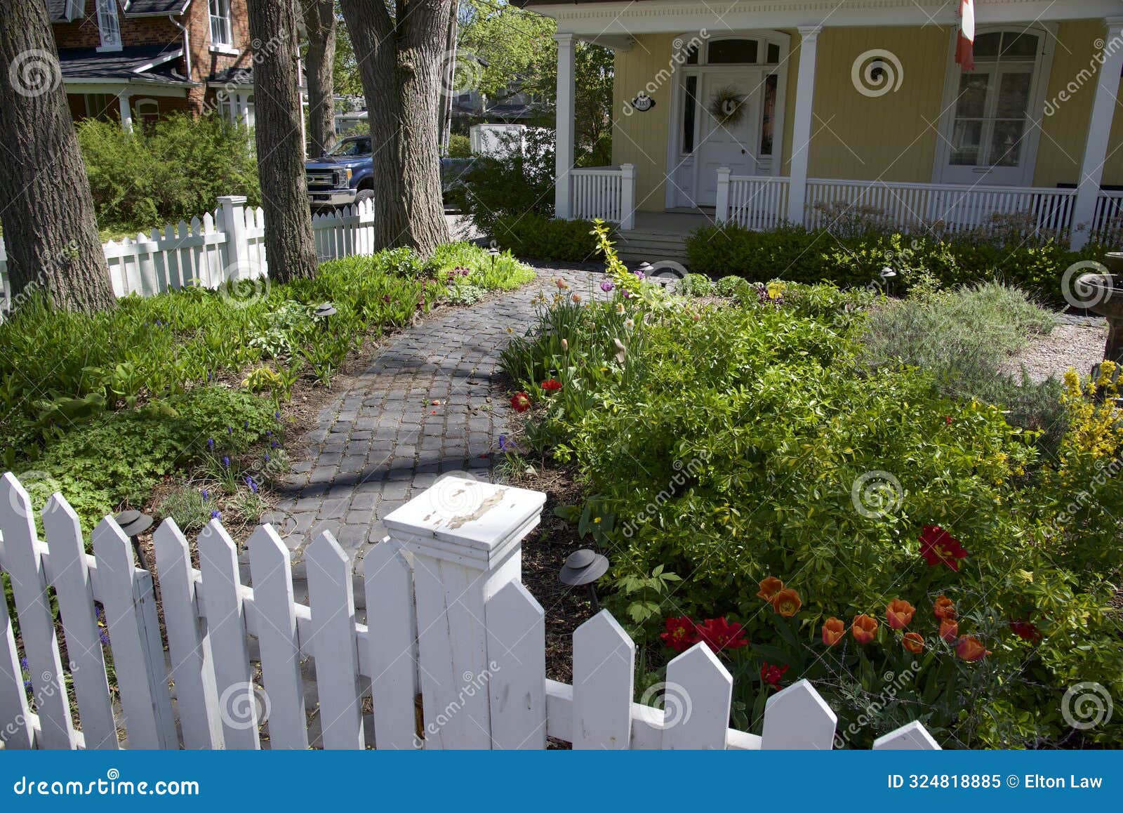 The Front-yard Garden with White Picket Fence Stock Image - Image of ...