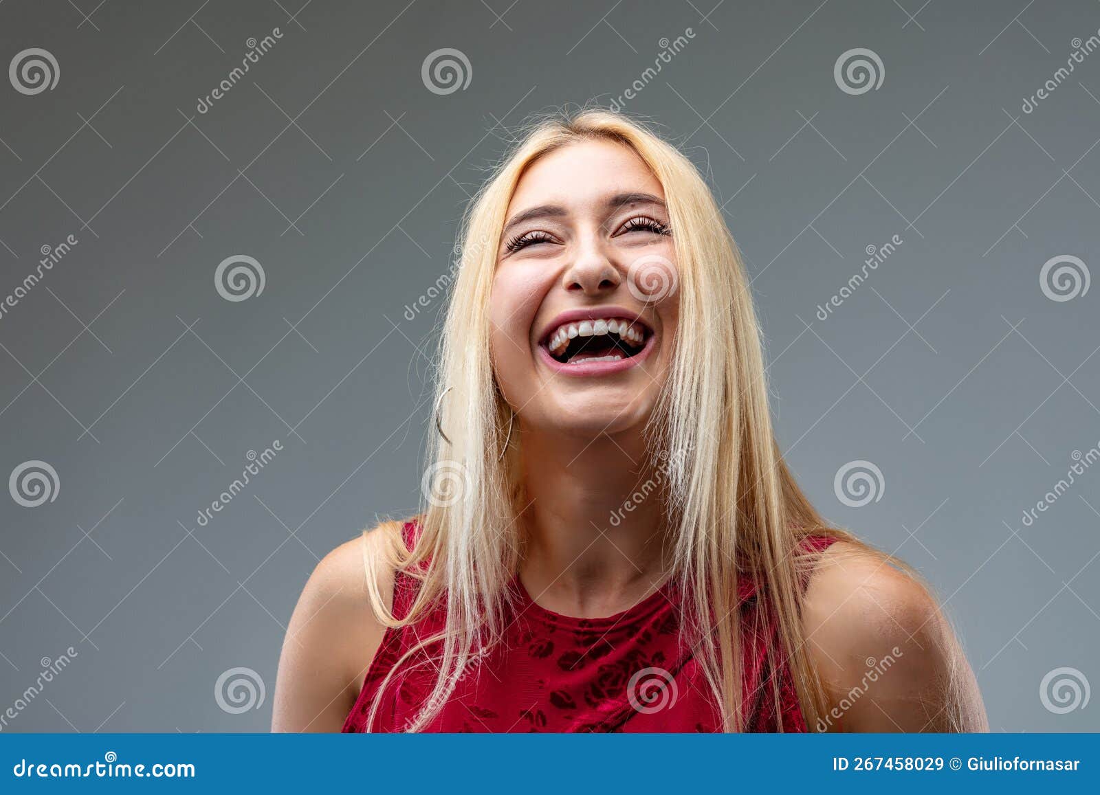 Blond Woman Laughing Joyfully In Red Dress Stock Image Image Of Happy
