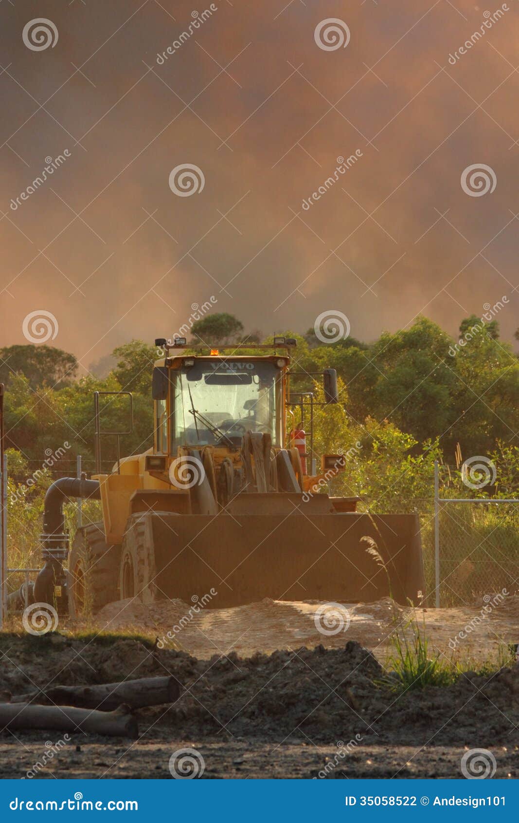 Frontend Loader with Backdrop of Approaching Bushfire Editorial ...