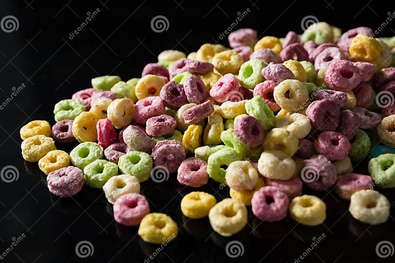 Froot Loops on Black Background Stock Photo - Image of nutrition ...