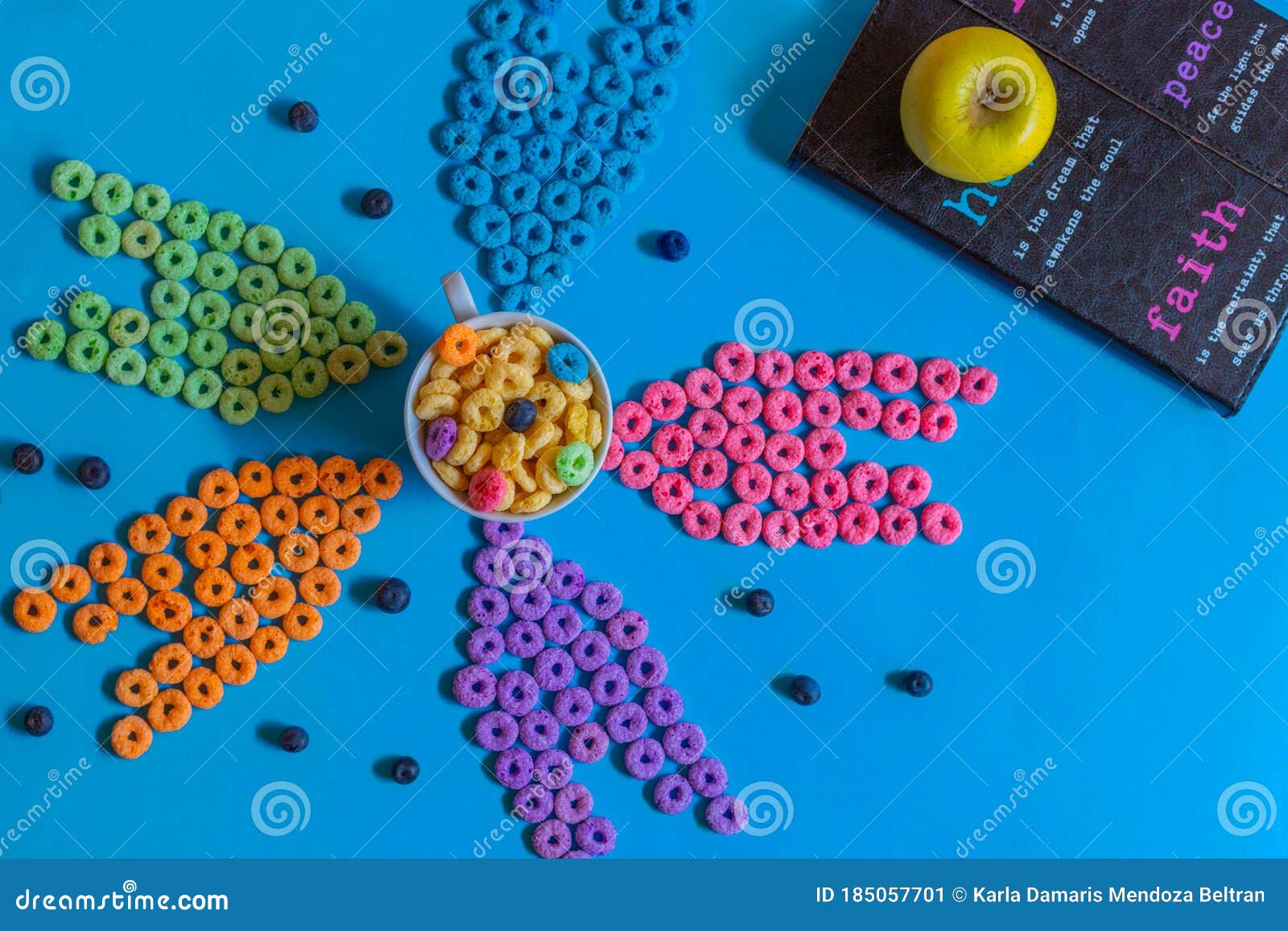 Froot Loops on Blue Table in Pattern, Blue, Pink, Yellow and Purple ...