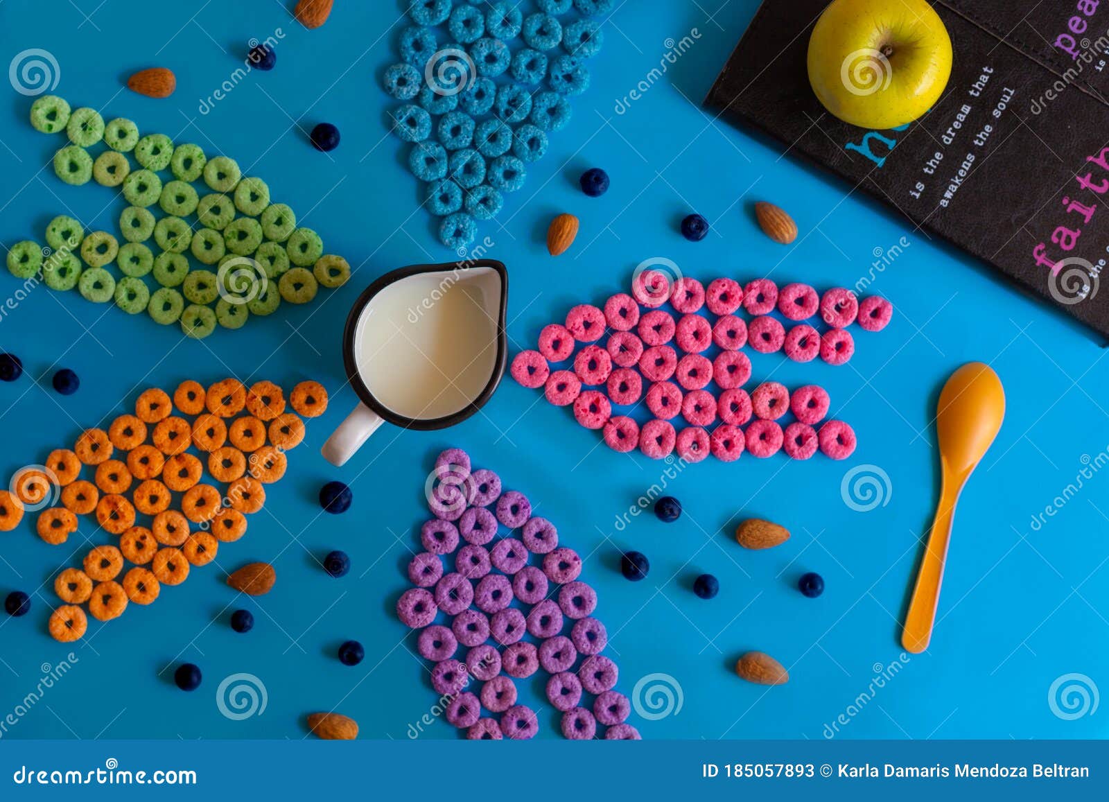Froot Loops on Blue Table in Pattern, Blue, Pink, Yellow and Purple ...
