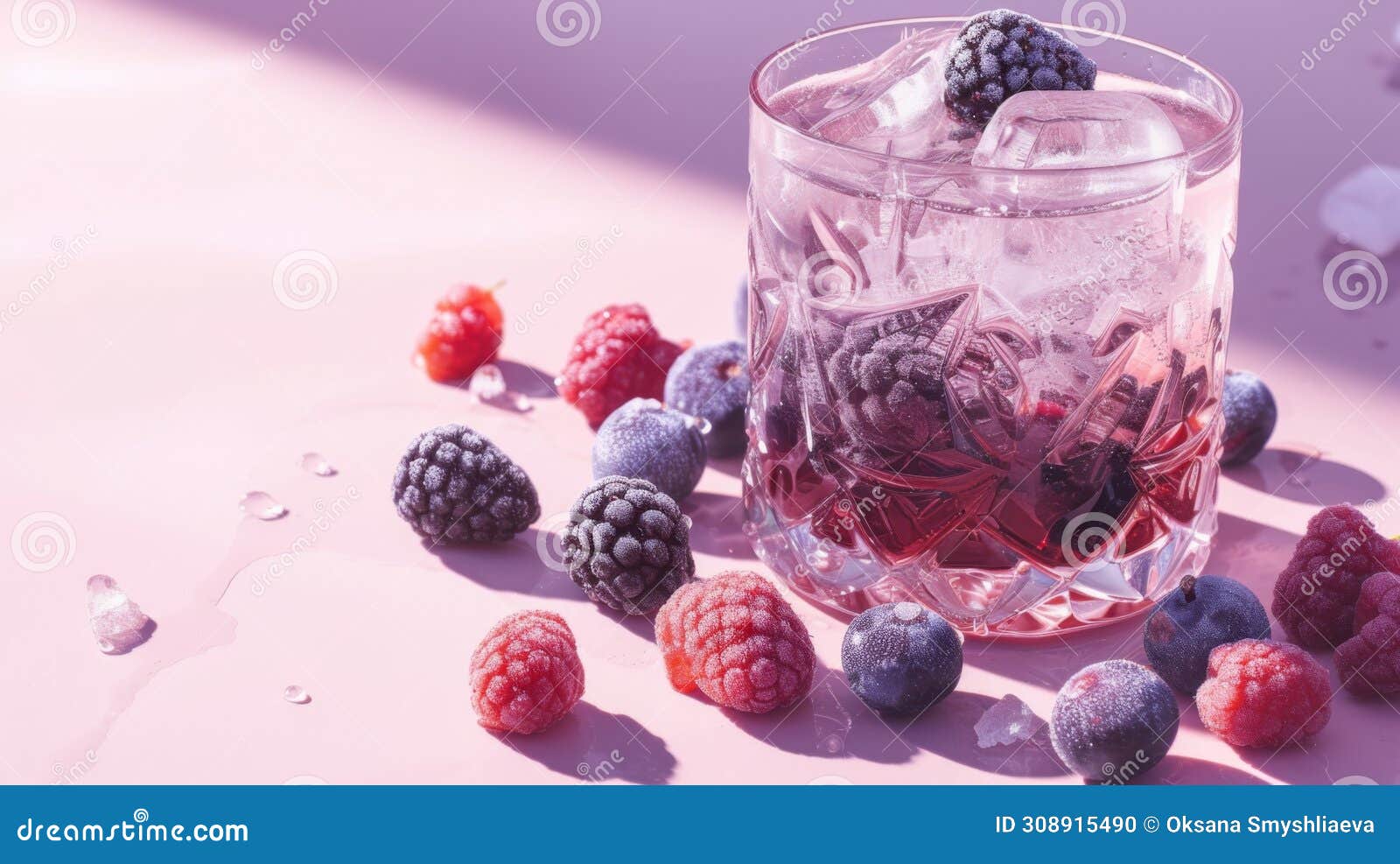 Frosted Berries and Crystal Cocktail on Pastel Surface Stock Photo ...