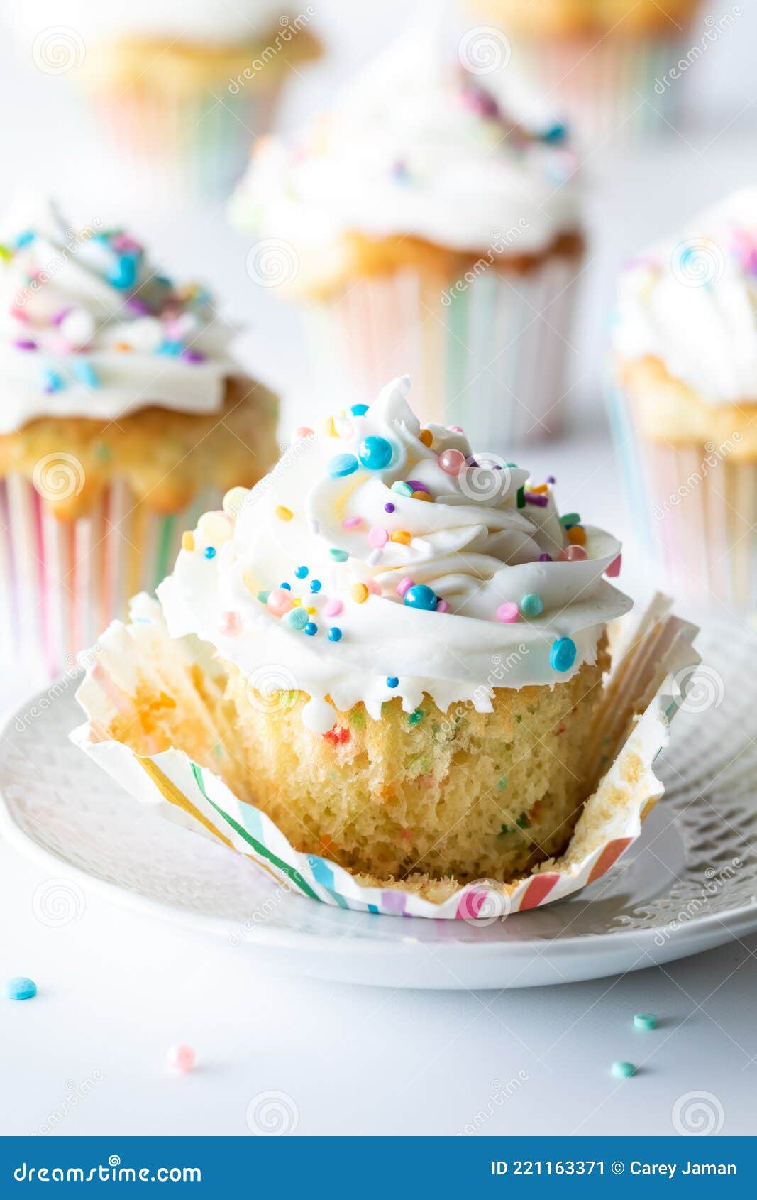 Frosted Confetti Cupcake Unwrapped Exposing Inside of the Cupcake ...