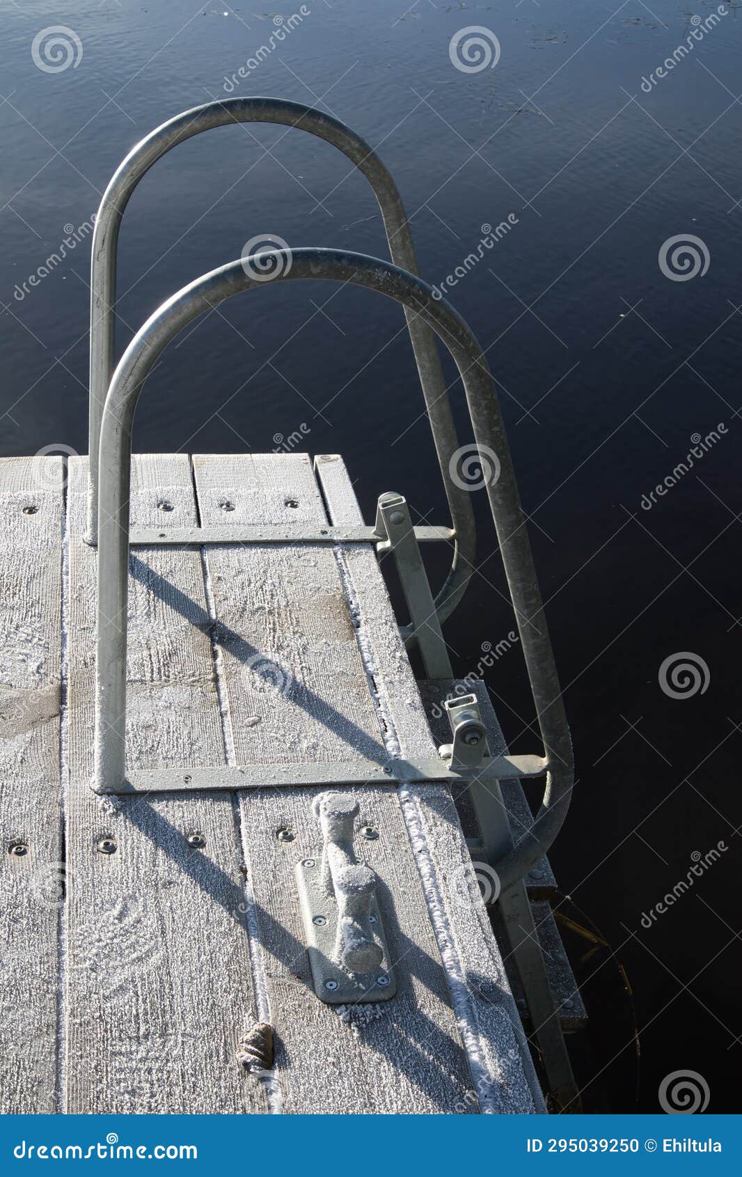 Frosty Jetty with a Ladder Leading into the Water Stock Photo - Image ...